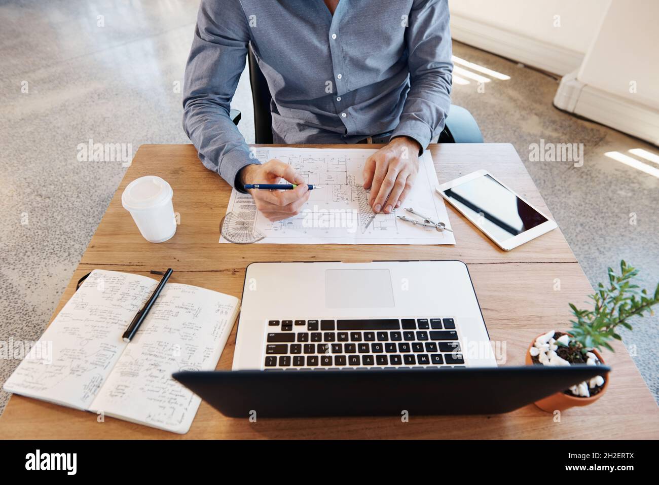 Making sure his plans are perfect Stock Photo - Alamy