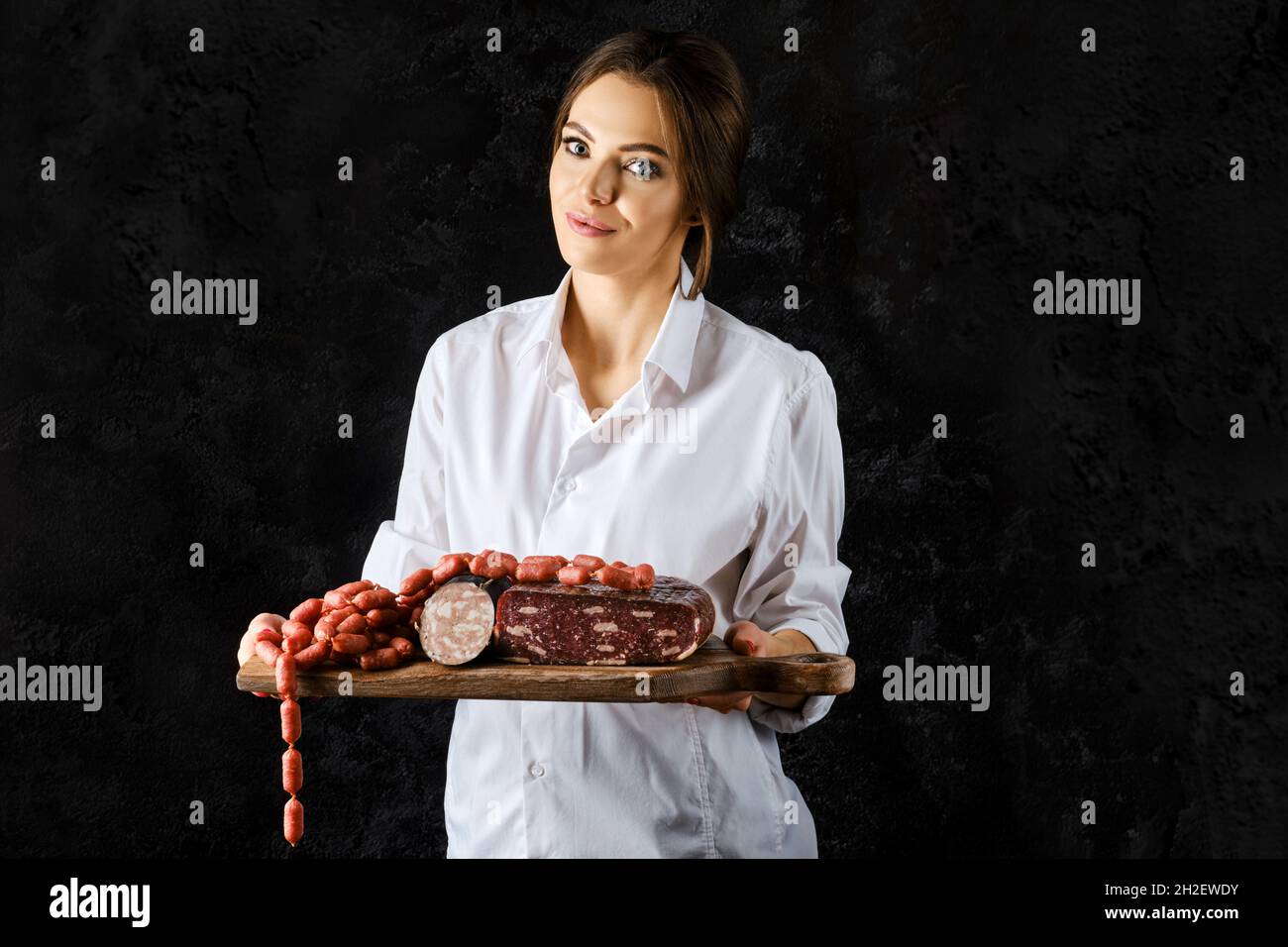 Woman eating pork sausage hi-res stock photography and images - Alamy
