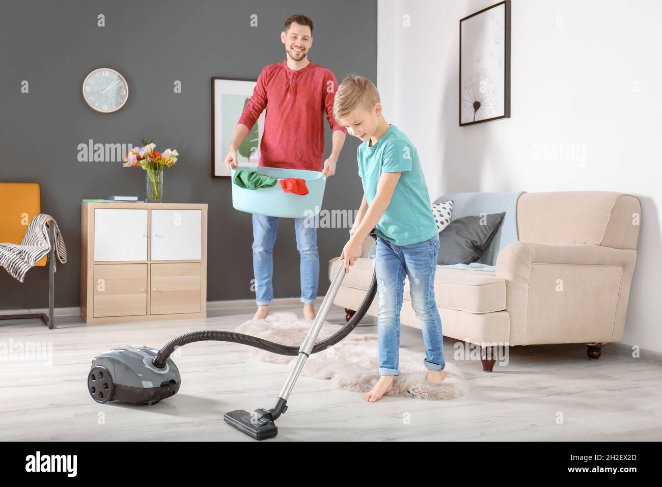 Little boy and his dad cleaning their house together Stock Photo - Alamy