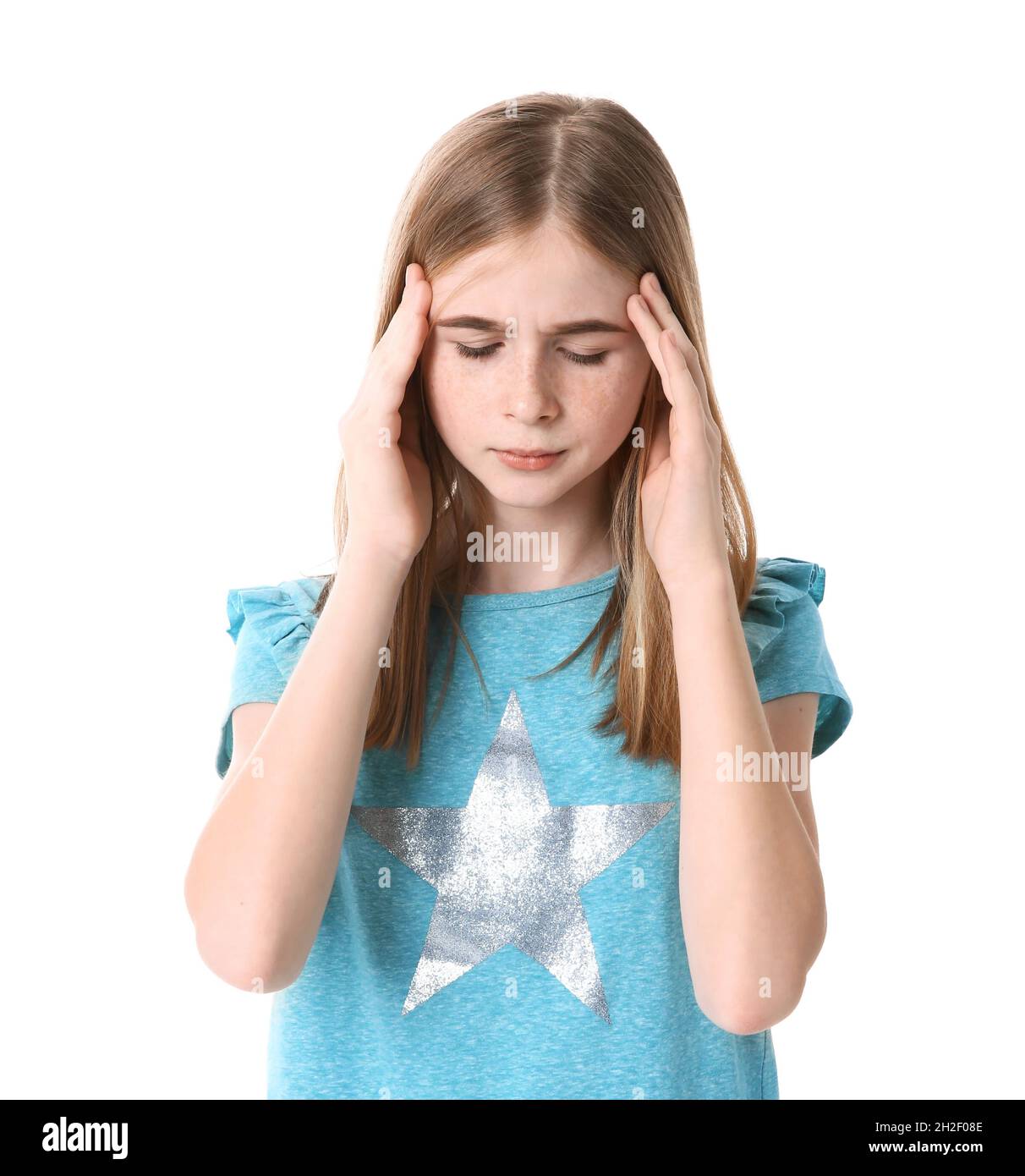 Teenage girl suffering from headache on white background Stock Photo ...