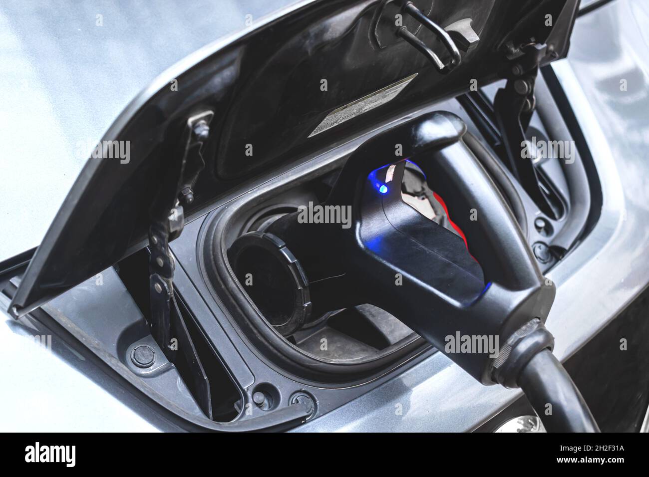 Electric vehicle charging, electrical car charging point, socket close ...