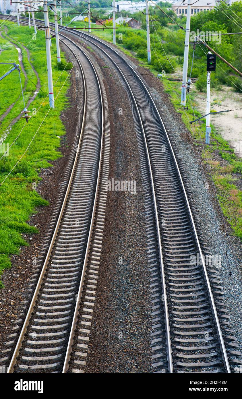 Parallel railway tracks recede into the distance in Volgograd city ...