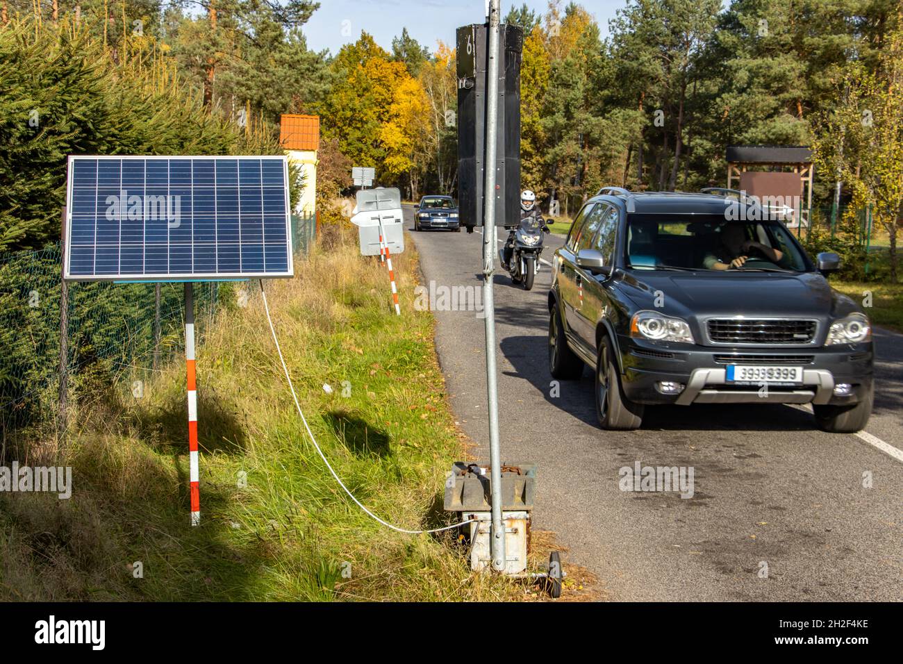 Road traffic is controlled by a traffic light powered by energy from a ...