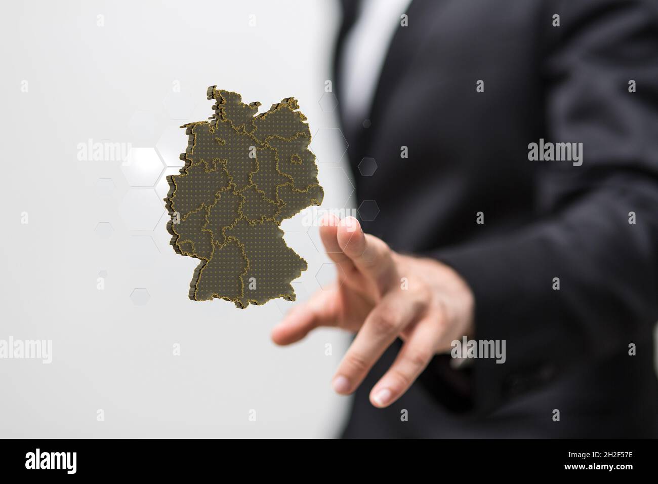 Human hand showing Germany map network Stock Photo - Alamy