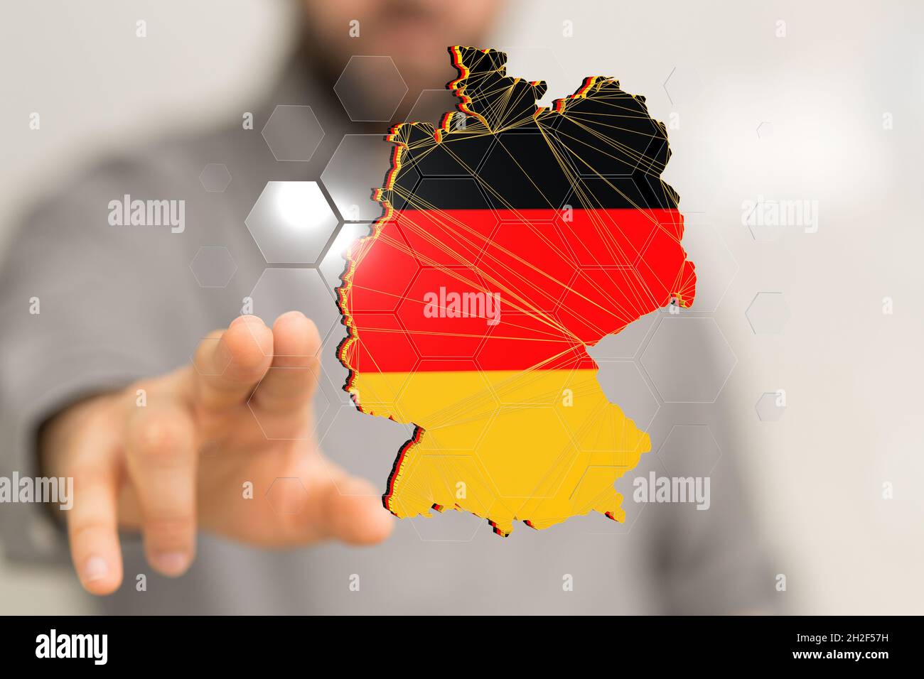 Human hand showing Germany map network Stock Photo - Alamy