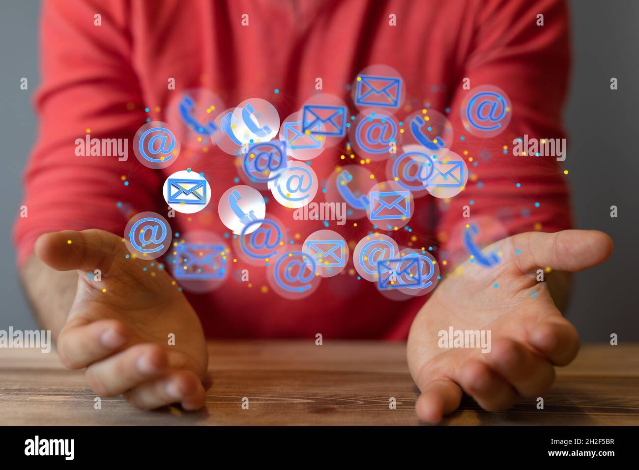 Male's hands holding illustrated of email inbox and phone signs Stock ...