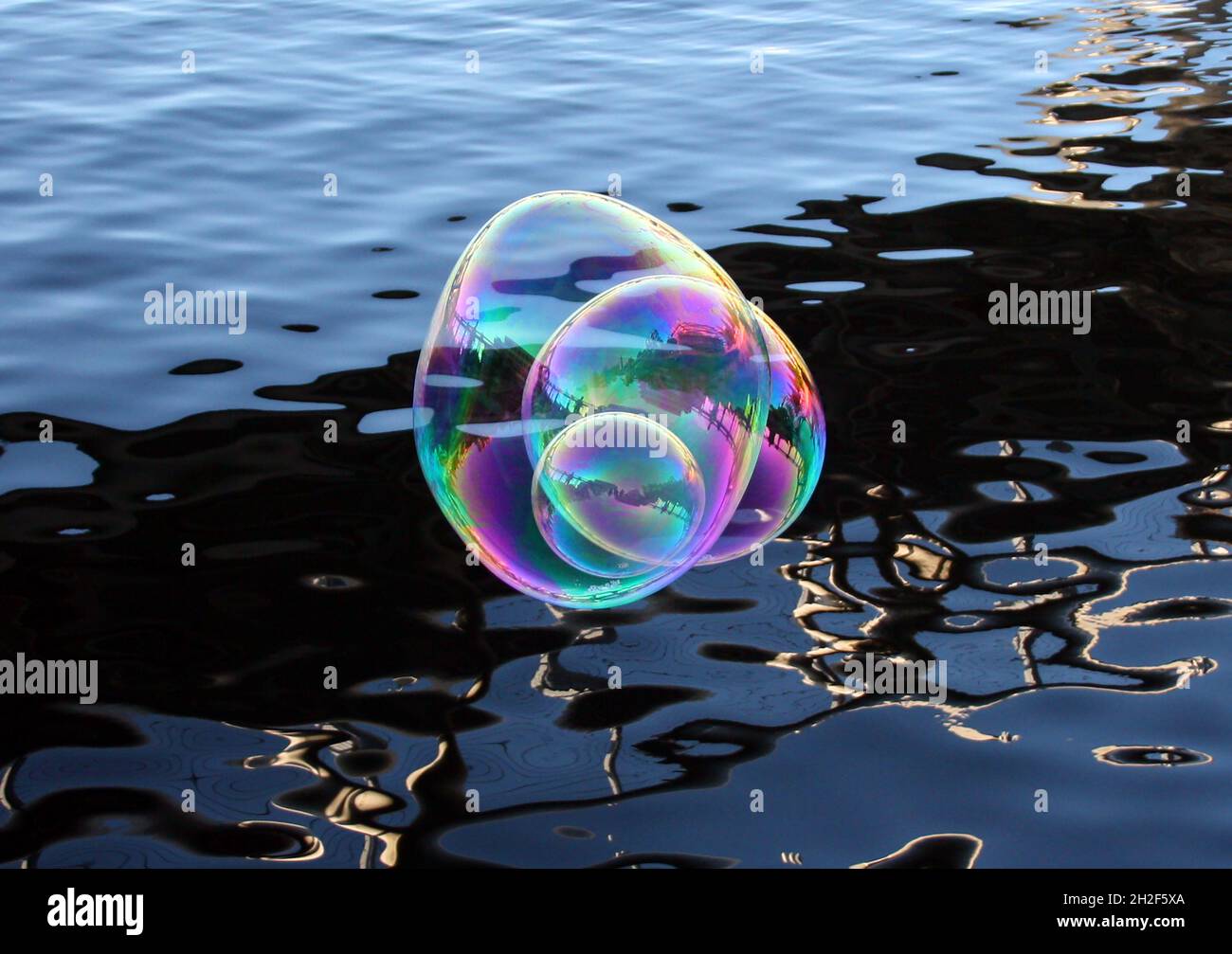 Soup bubbles on a water outside Stock Photo - Alamy