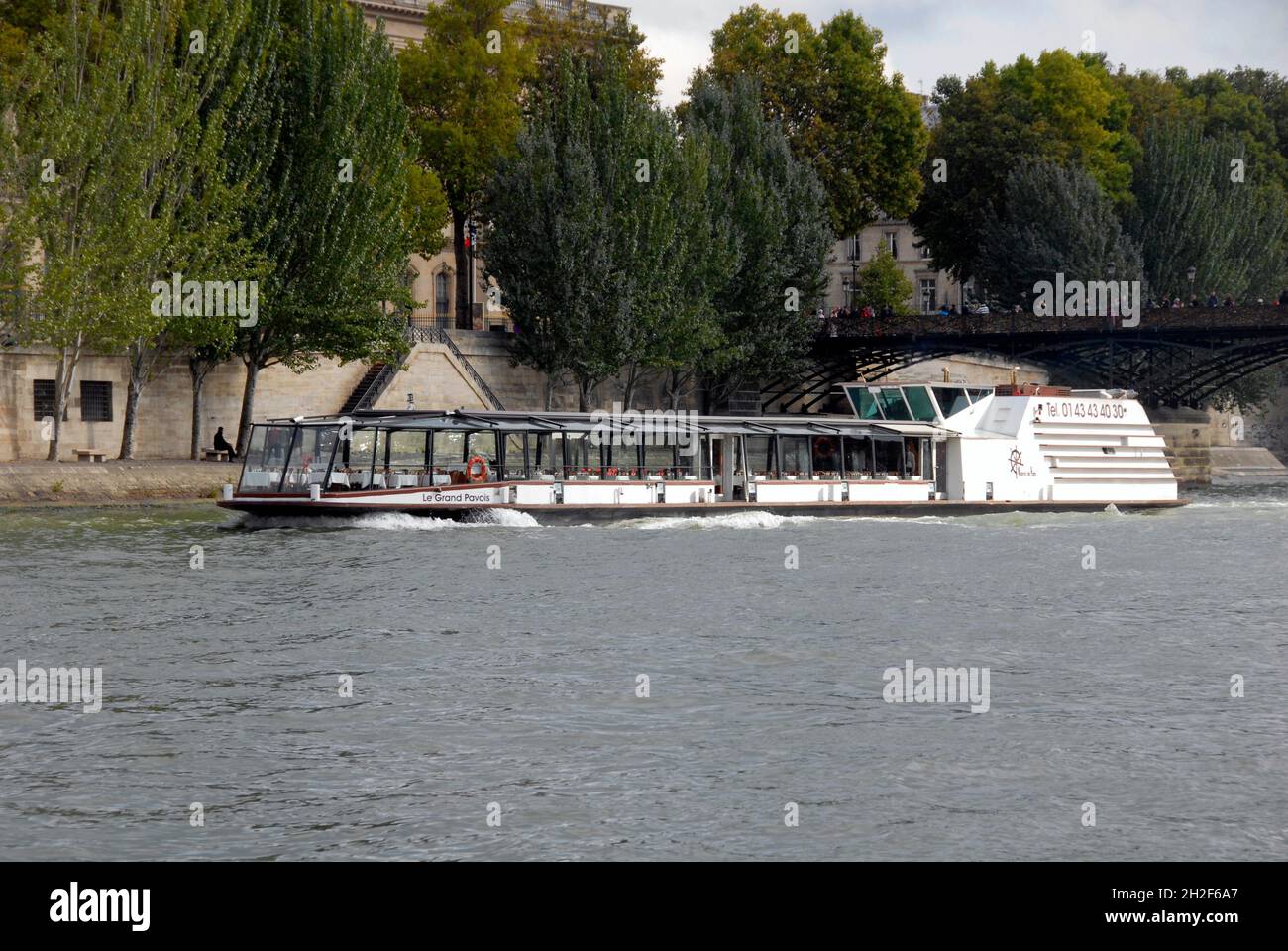 Floating restaurant vessel, empty, under way on the river Seine, Paris ...