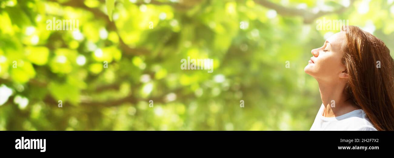 Woman Breathing Clean Air In Nature With Eyes Closed Stock Photo - Alamy