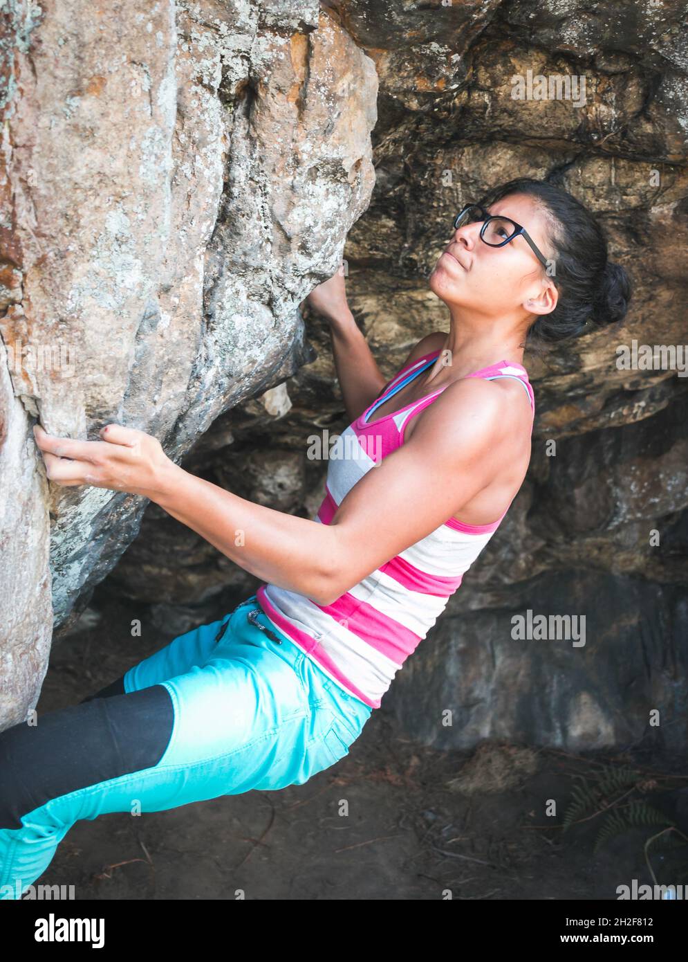 Strong female rock climber bouldering Stock Photo - Alamy