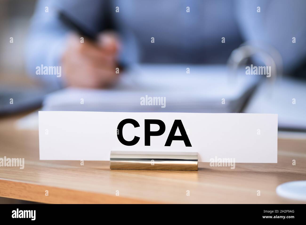 CPA Name Plate On The Desk With The Businesswoman Analyzing The Invoice ...