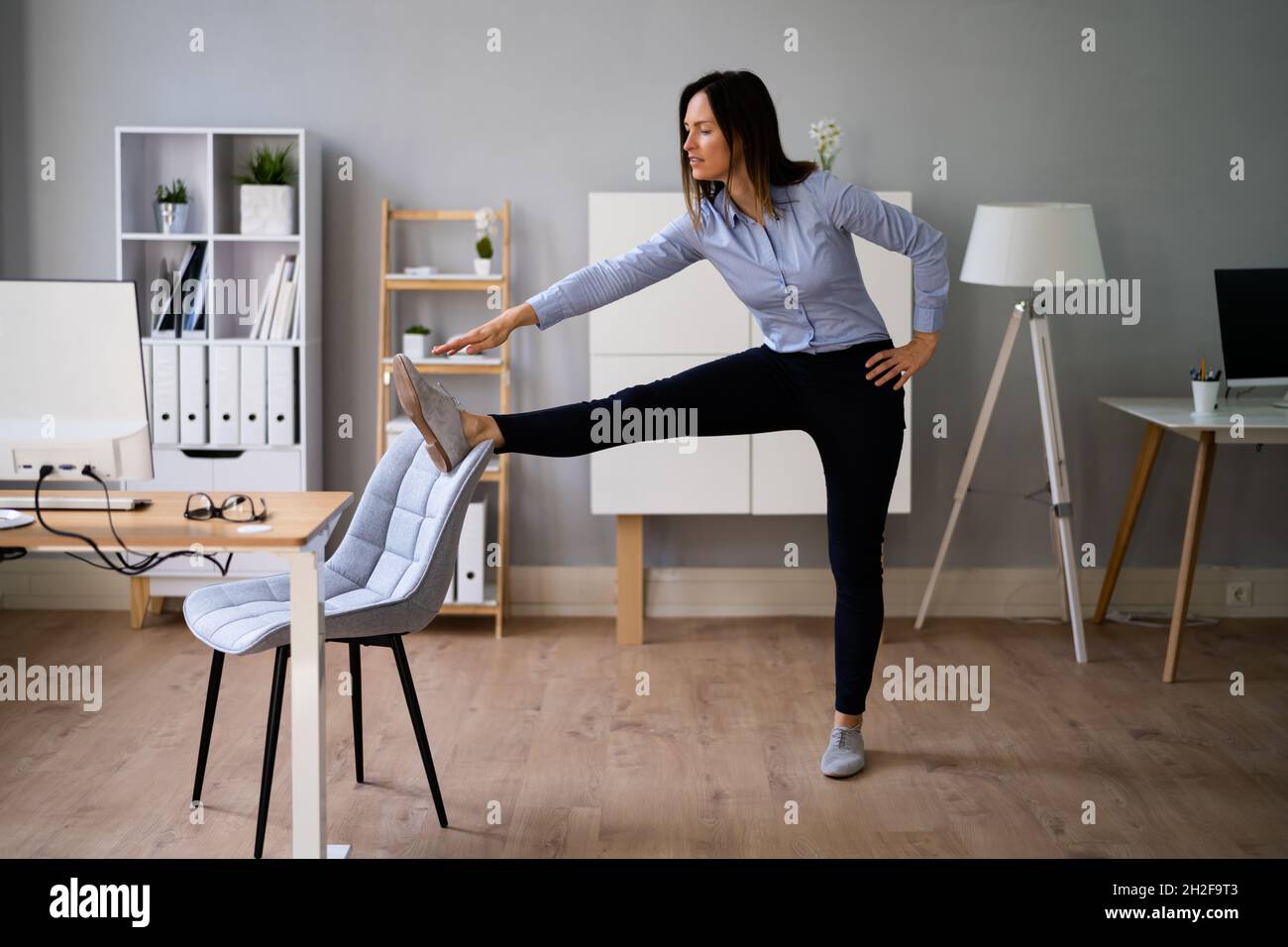 Stretch Exercise Workout Near Office Desk. Worker Stretching Stock ...