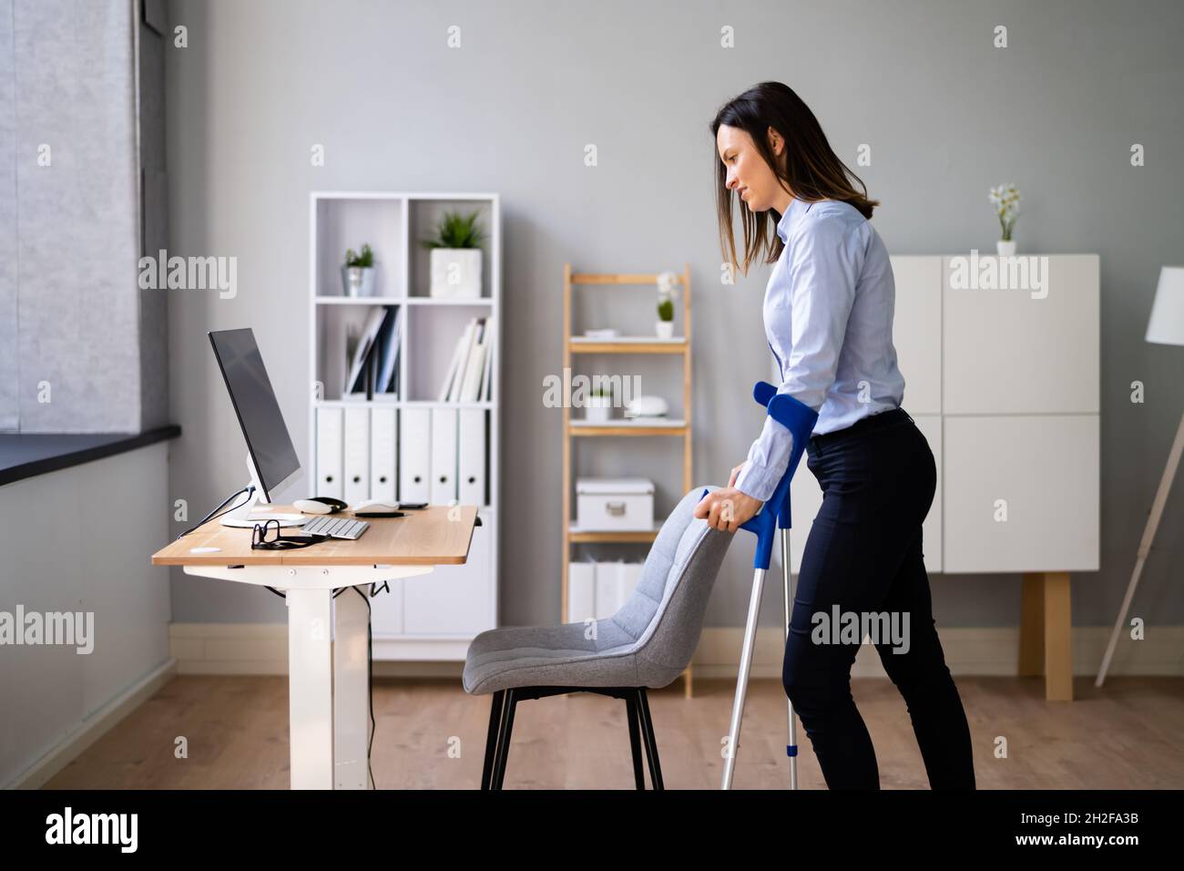 Injured Worker Rehabilitation In Office. Workplace Benefits Stock Photo ...