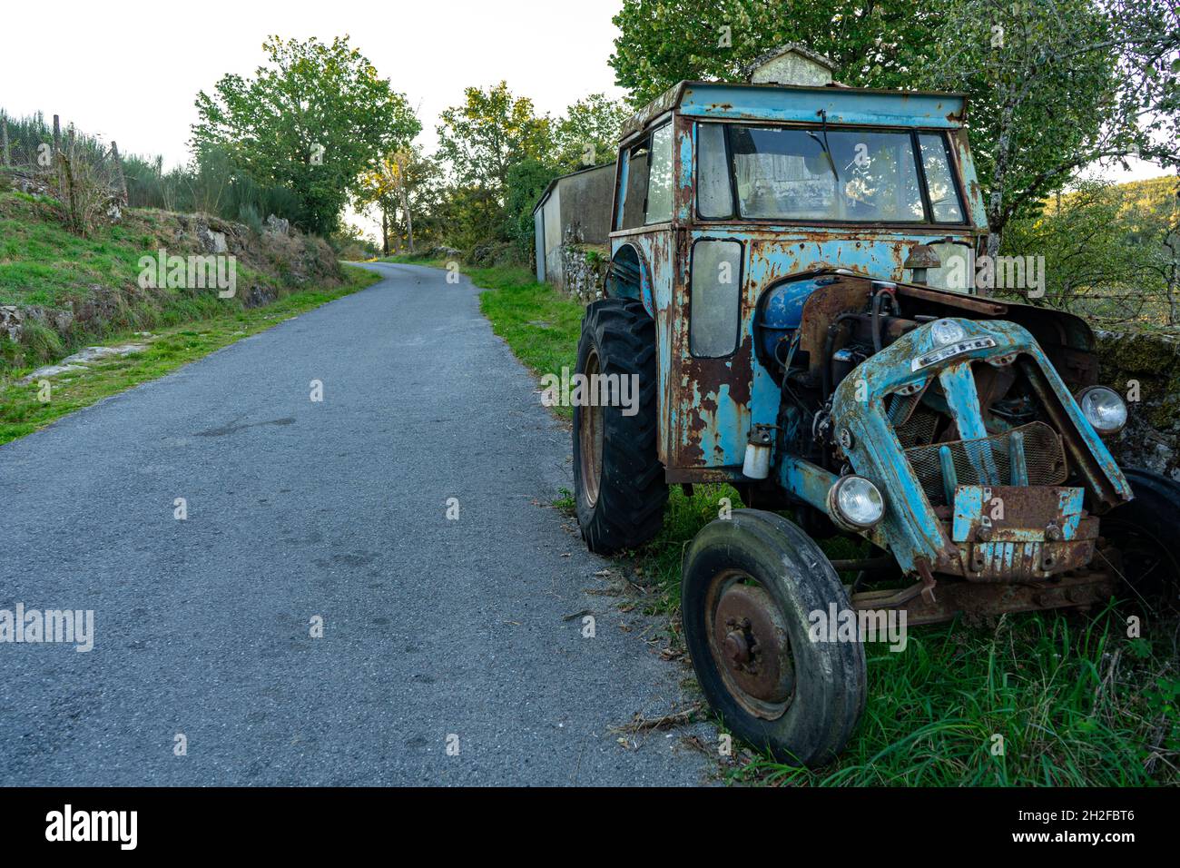abandoned agricultural tractor and rusty nostalgia for old times Stock ...
