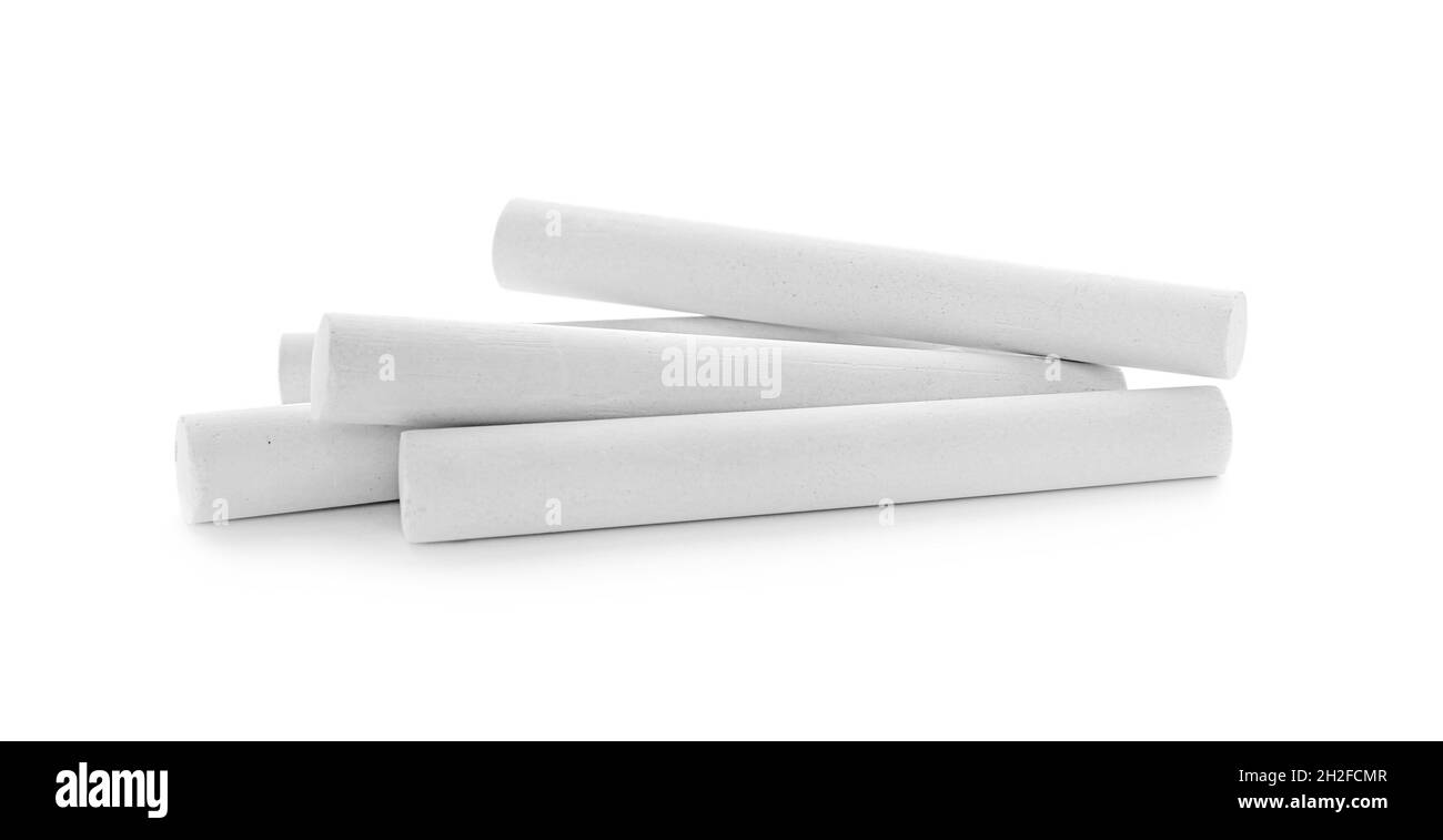 Small pieces of chalk on white background Stock Photo - Alamy