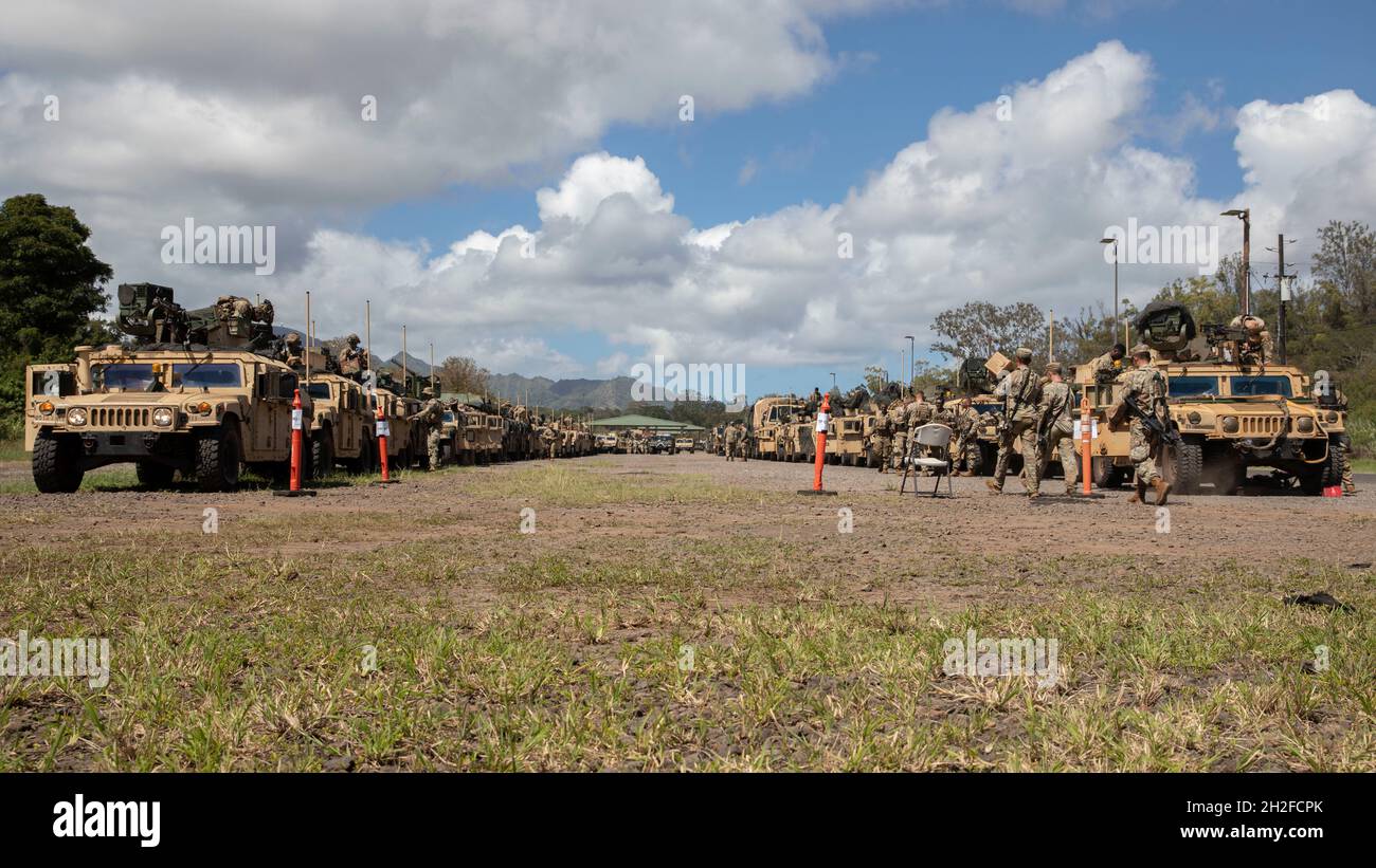 A convoy of M1151 Enhanced Armament Carriers prepare for movement ...