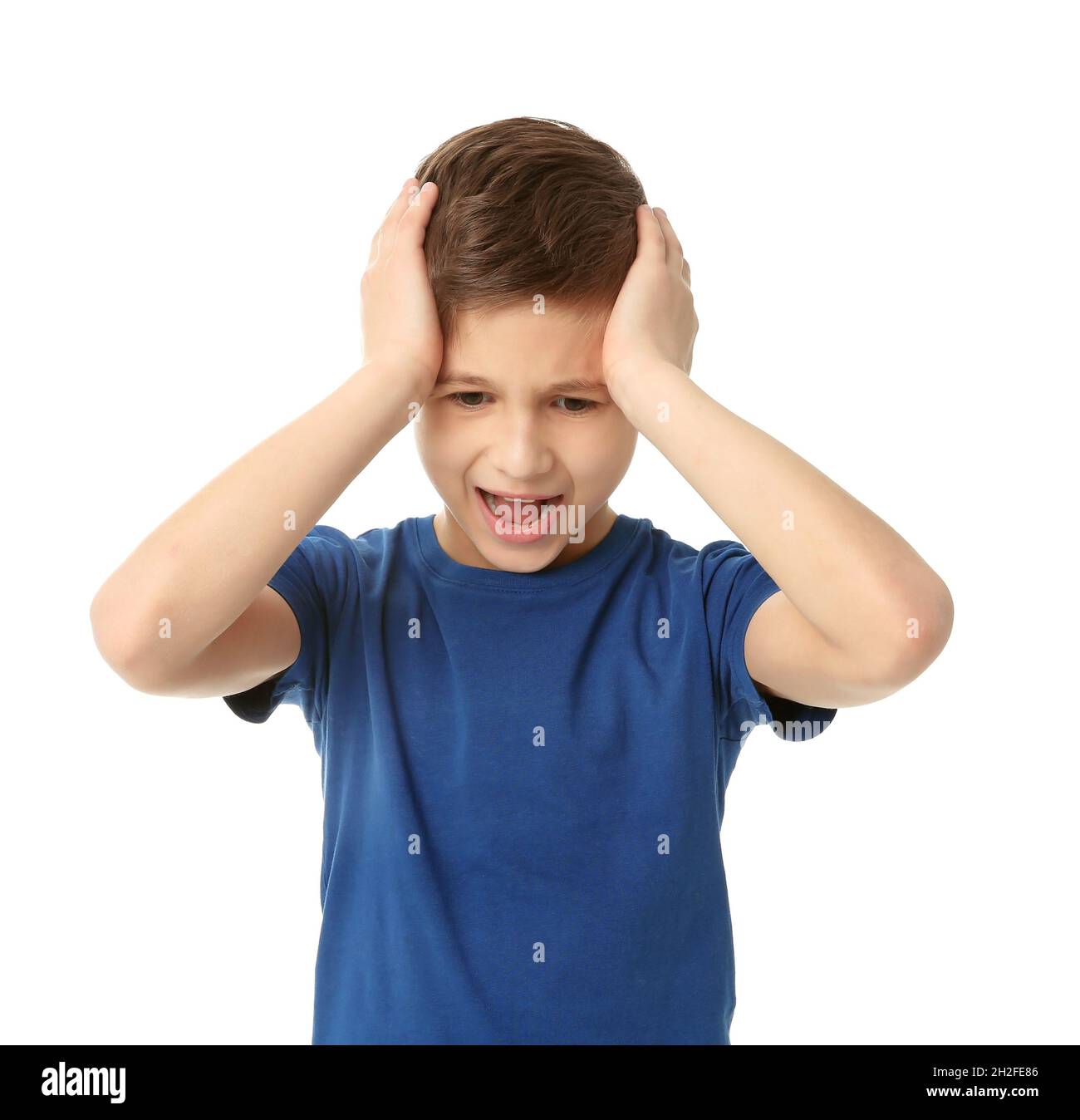 Little boy suffering from headache on white background Stock Photo - Alamy