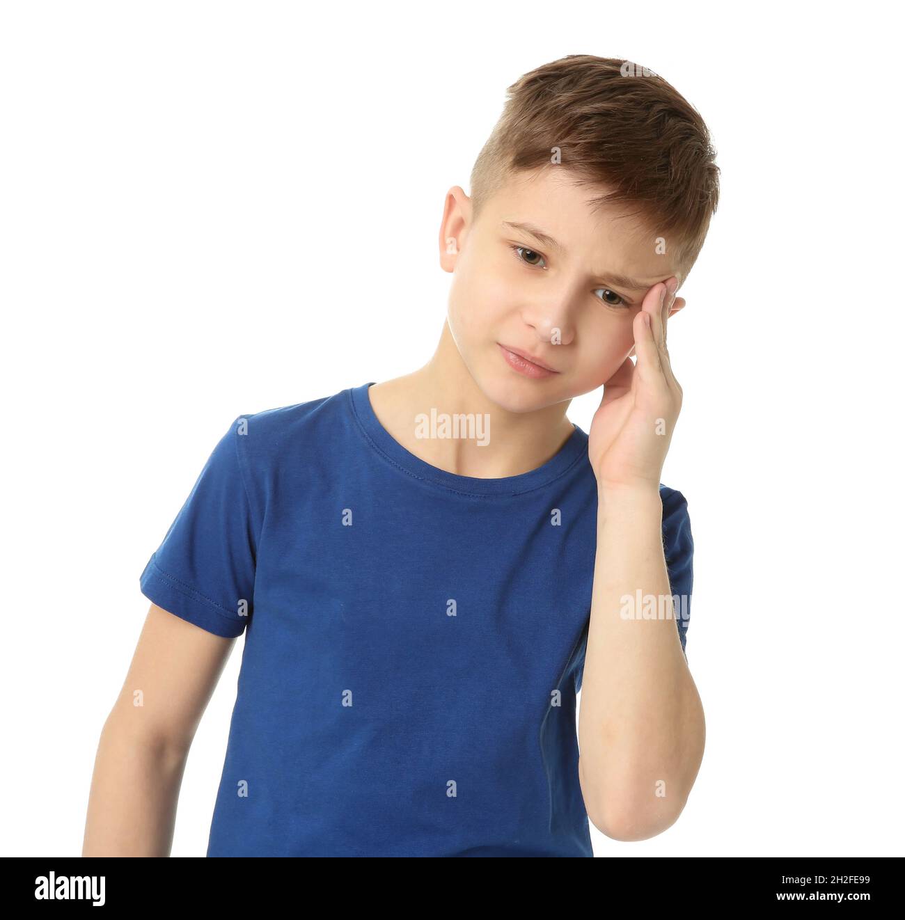 Little boy suffering from headache on white background Stock Photo - Alamy