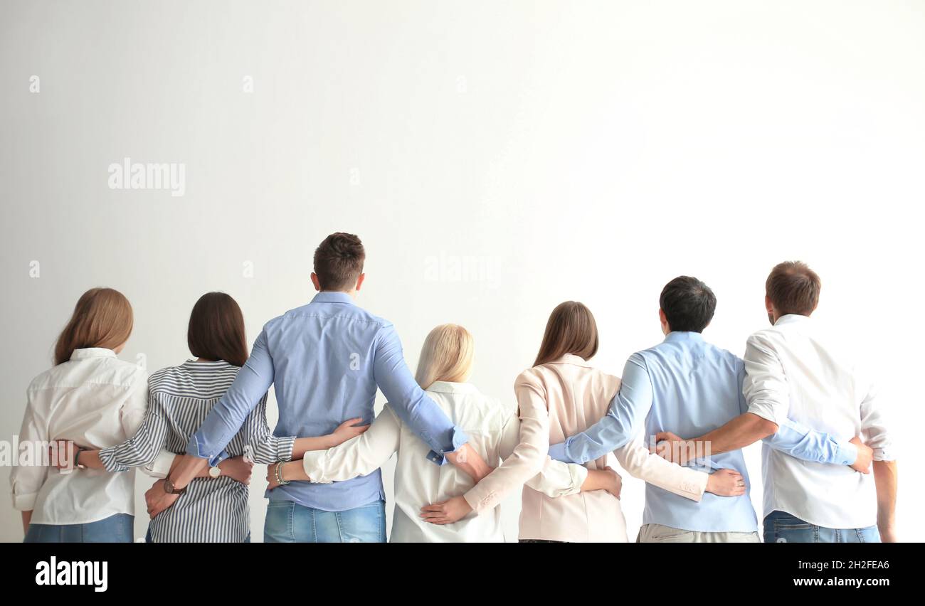 People holding hands on light background. Unity concept Stock Photo - Alamy