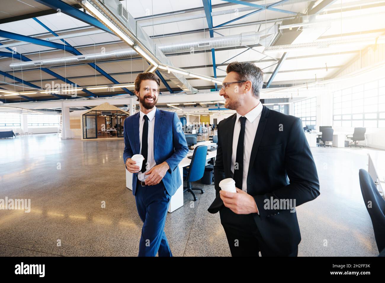 Showing a client around the office Stock Photo - Alamy