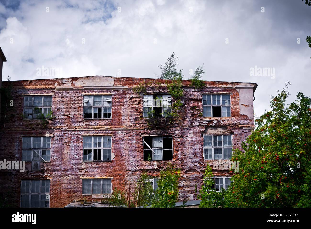 Old building with broken windows and destroyed walls Stock Photo - Alamy