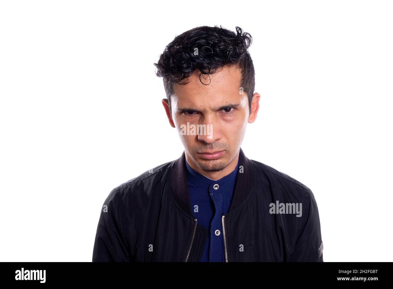 Latin man with angry look, isolated on white background. Young adult ...