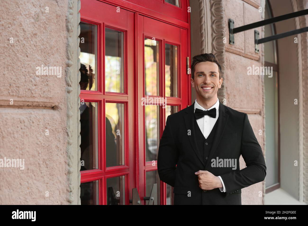 Happy Smiling Doorman High Resolution Stock Photography and Images - Alamy