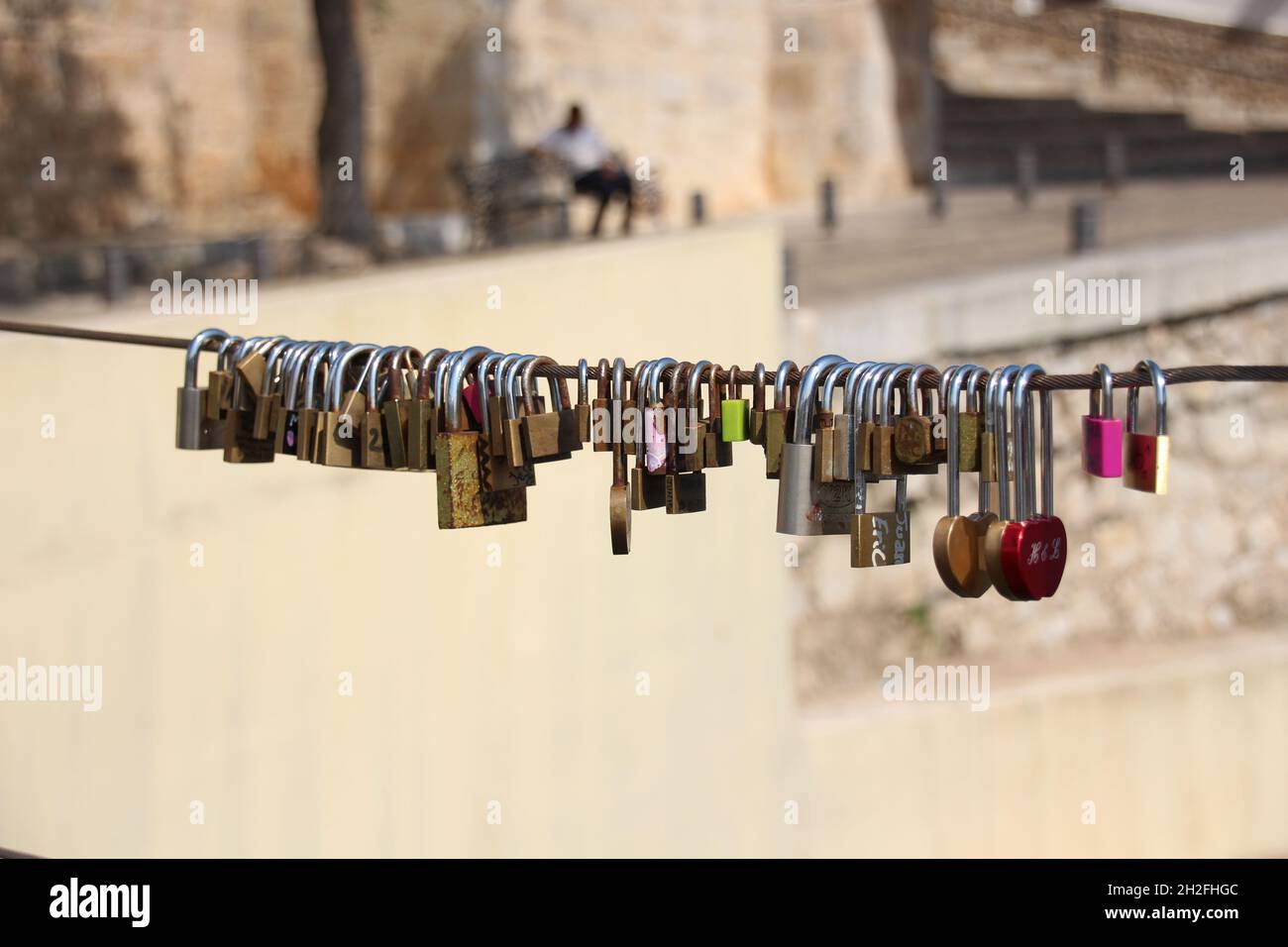 Love padlocks hanging on a rope outdoors symbolizing eternal love ...