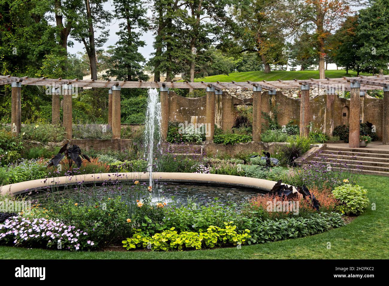 The old Rose Garden with view of the fountain in center and flowers in ...