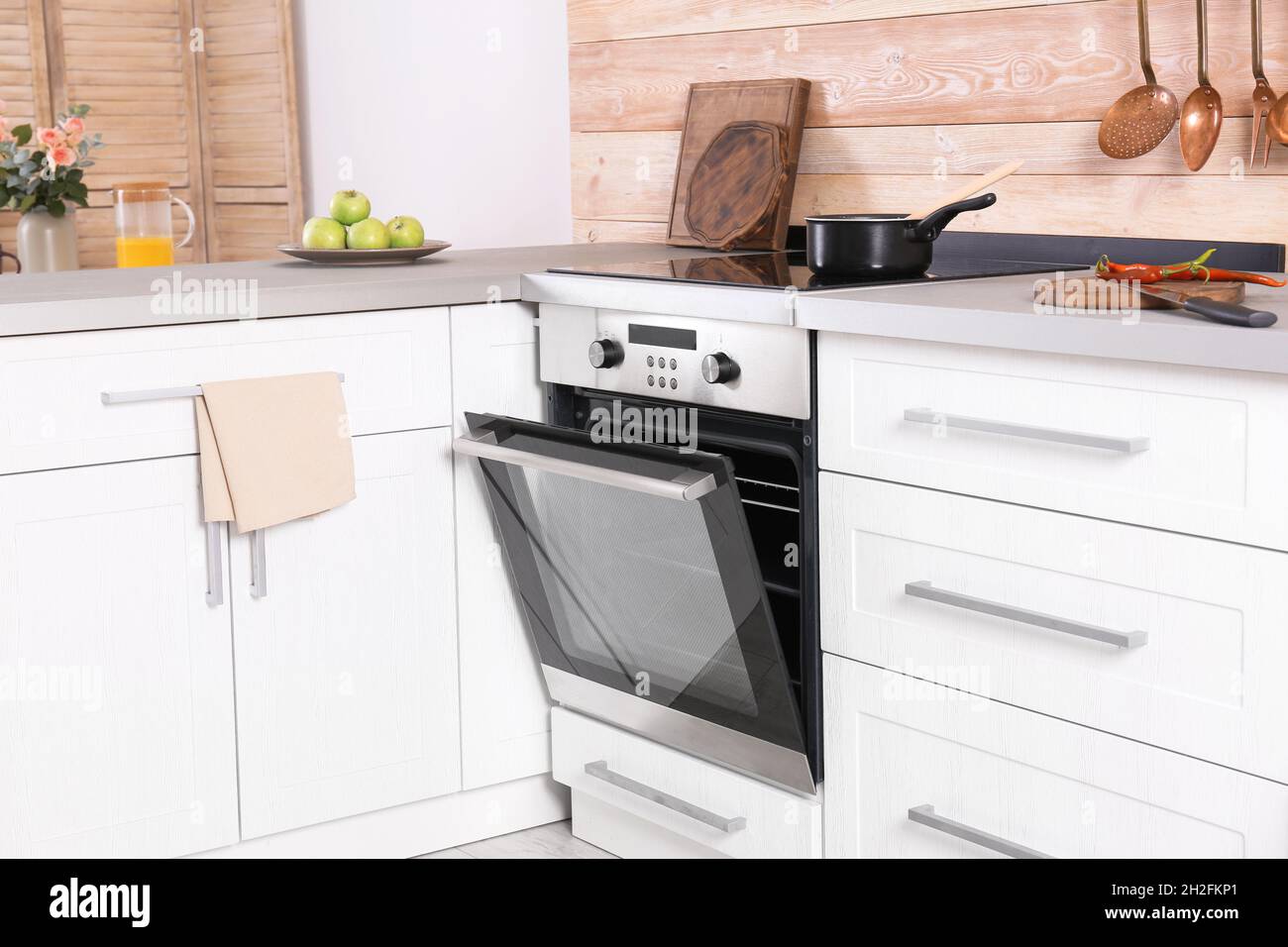 Light modern kitchen interior with new oven Stock Photo - Alamy