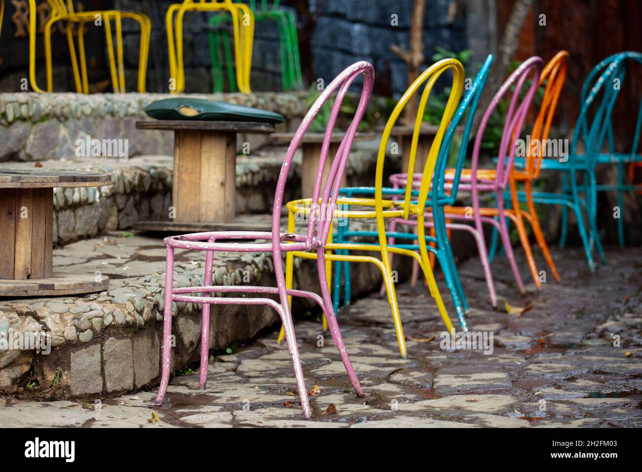 Group of colorful painted chairs at the small town of Salento in ...