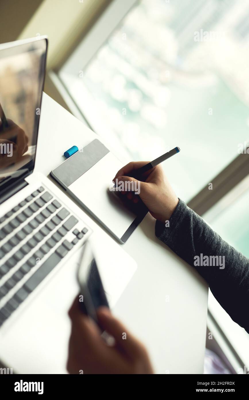 Right hand holding pen, working on graphic tablet. Shallow depth of field. Designer freelancer ...