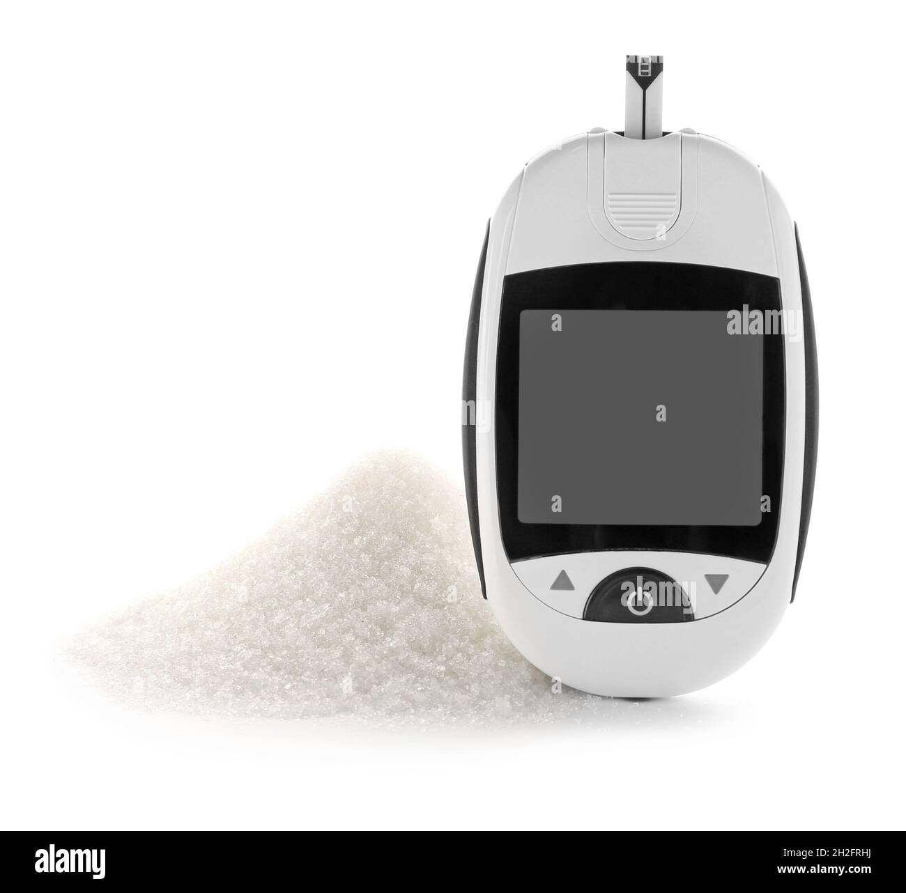 Digital glucometer and pile of sugar on white background. Diabetes ...