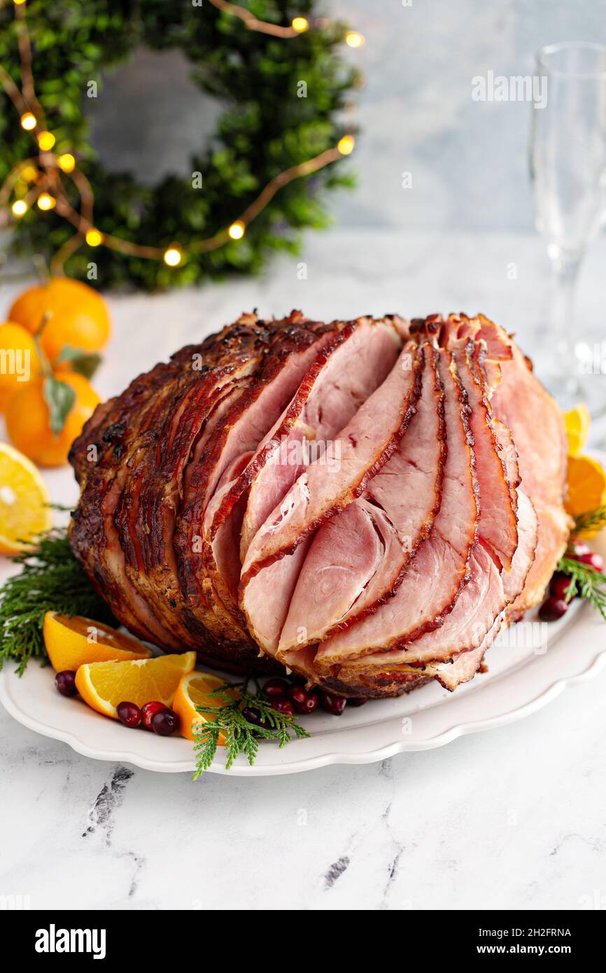Spiral sliced Christmas ham with orange honey glaze Stock Photo - Alamy