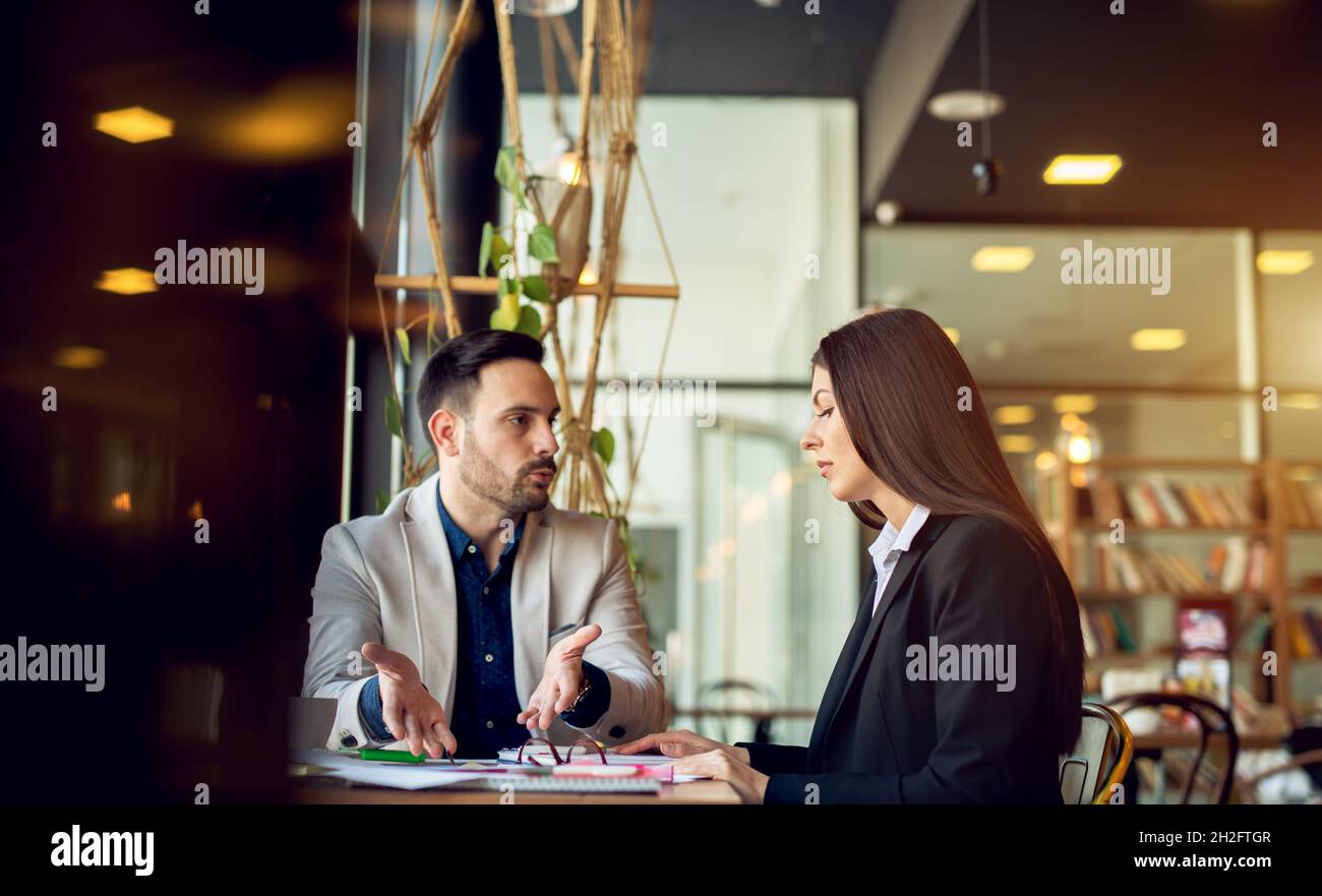 Business people explaining each other problem solutions Stock Photo - Alamy