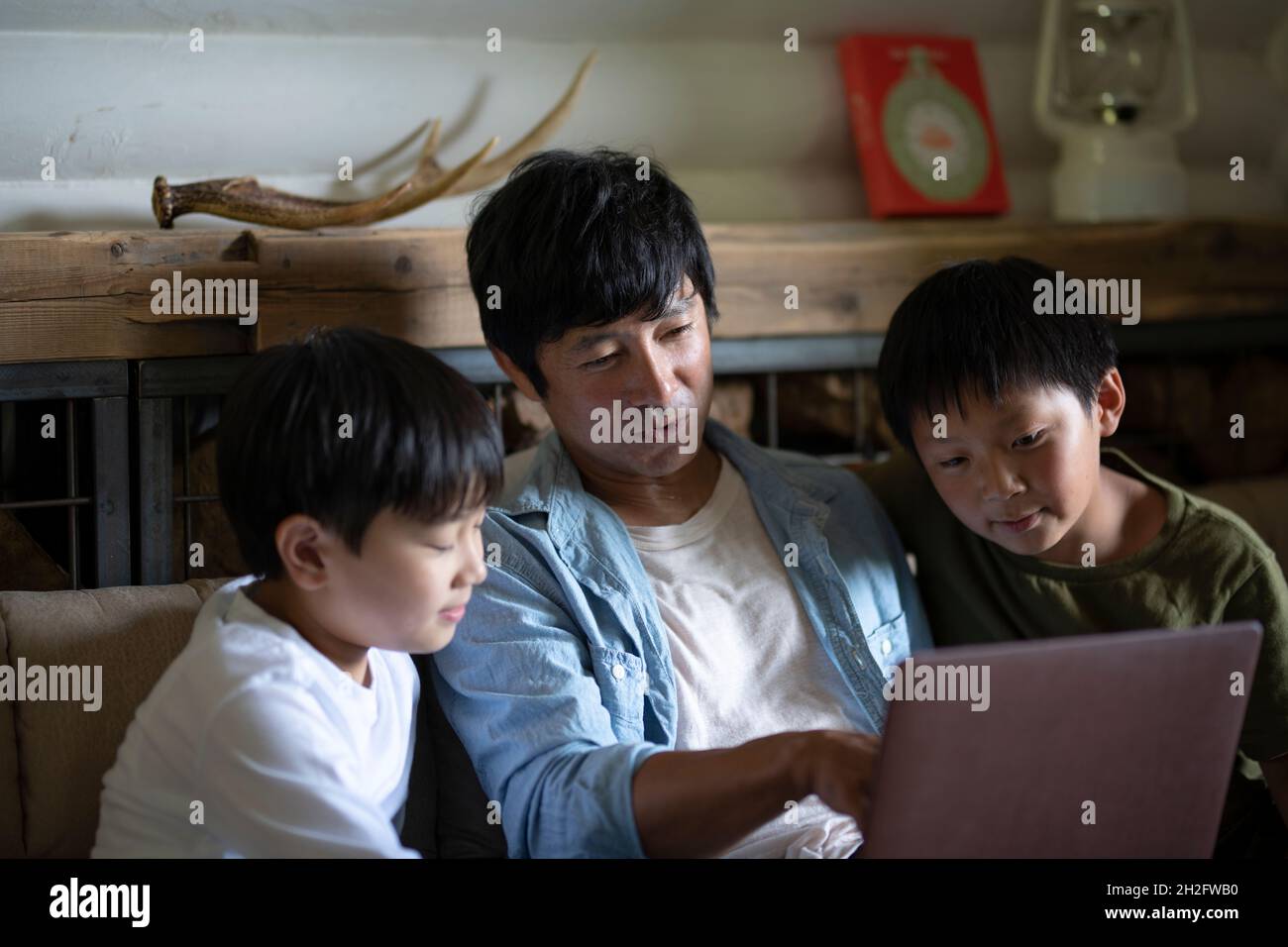 Father and Son Watching PC Stock Photo - Alamy