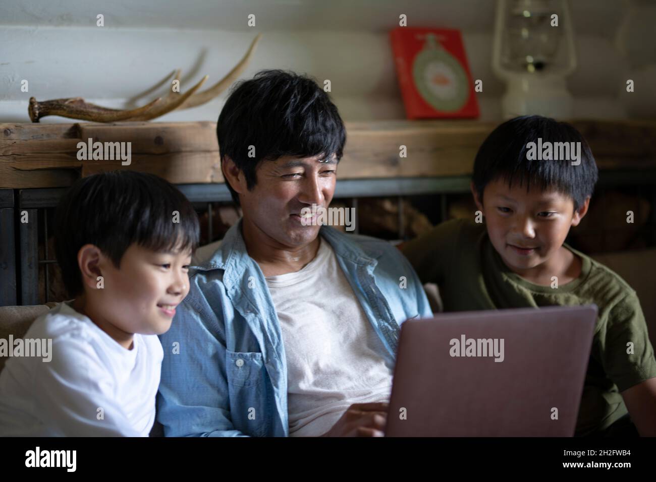 Father and Son Watching PC Stock Photo - Alamy