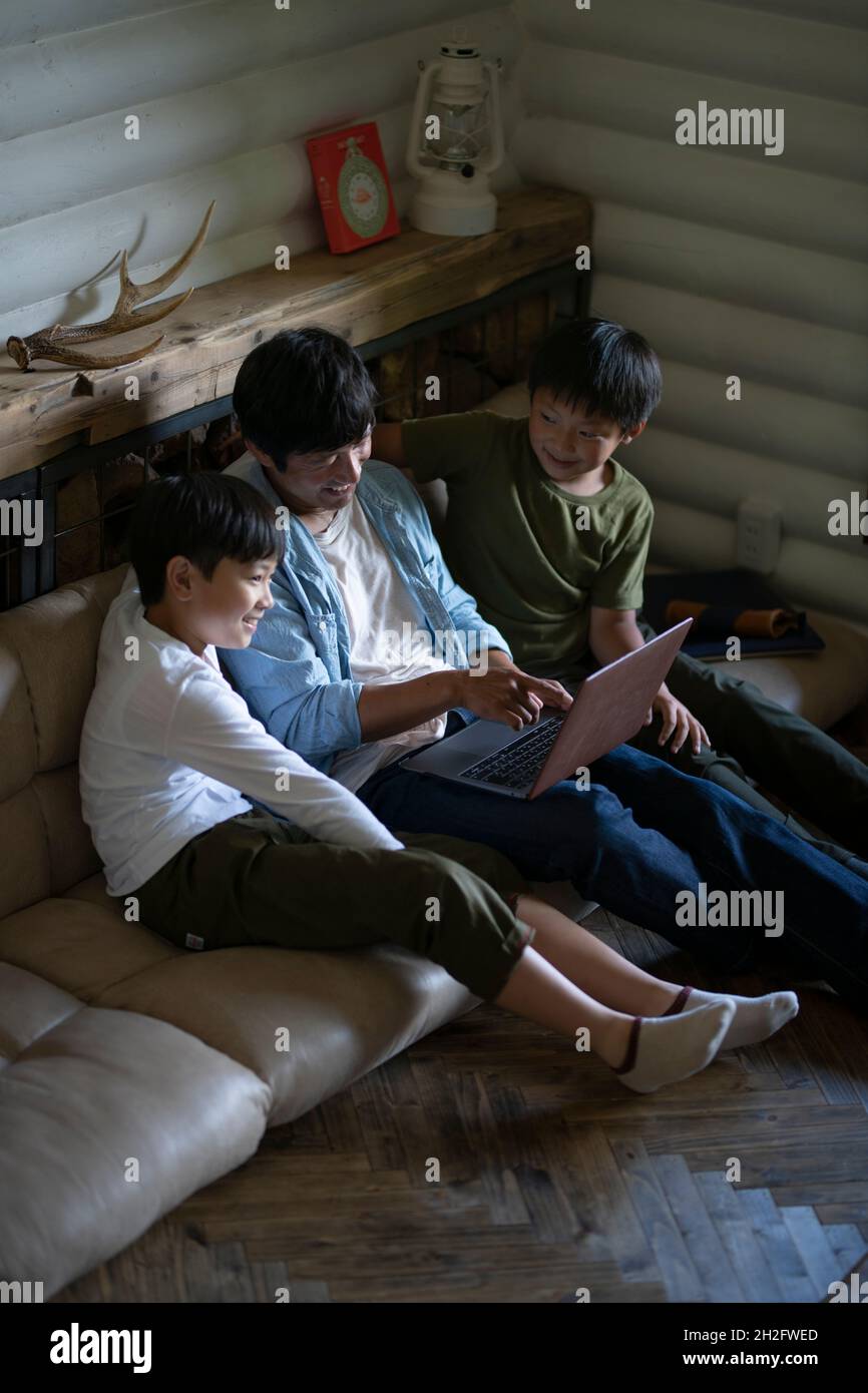 Father and Son Watching PC Stock Photo - Alamy