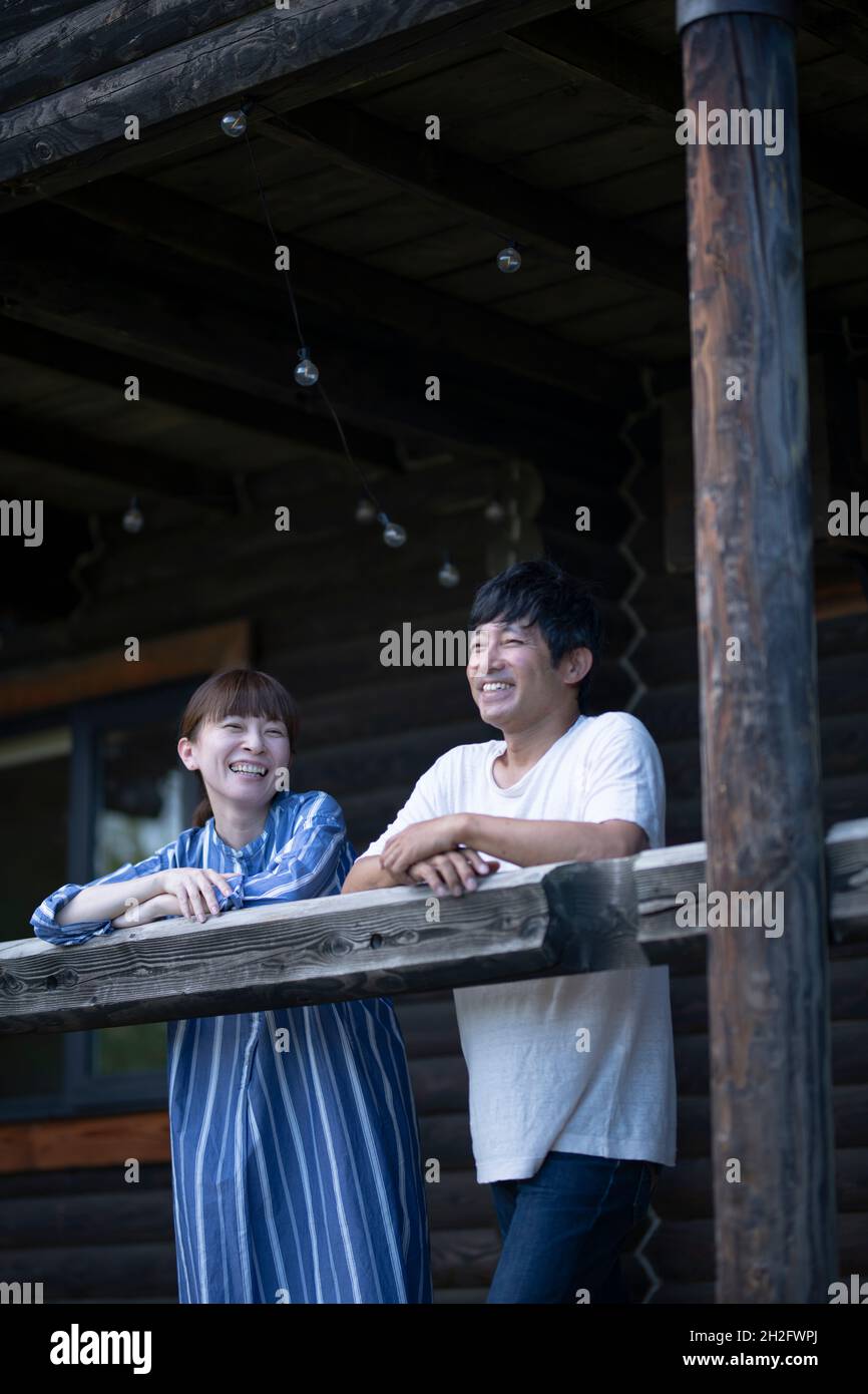 Couple Relaxing on the Terrace Stock Photo - Alamy