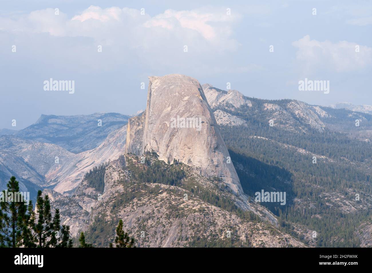 Landscape of the Half Dome under a blue cloudy sky in Yosemite National ...
