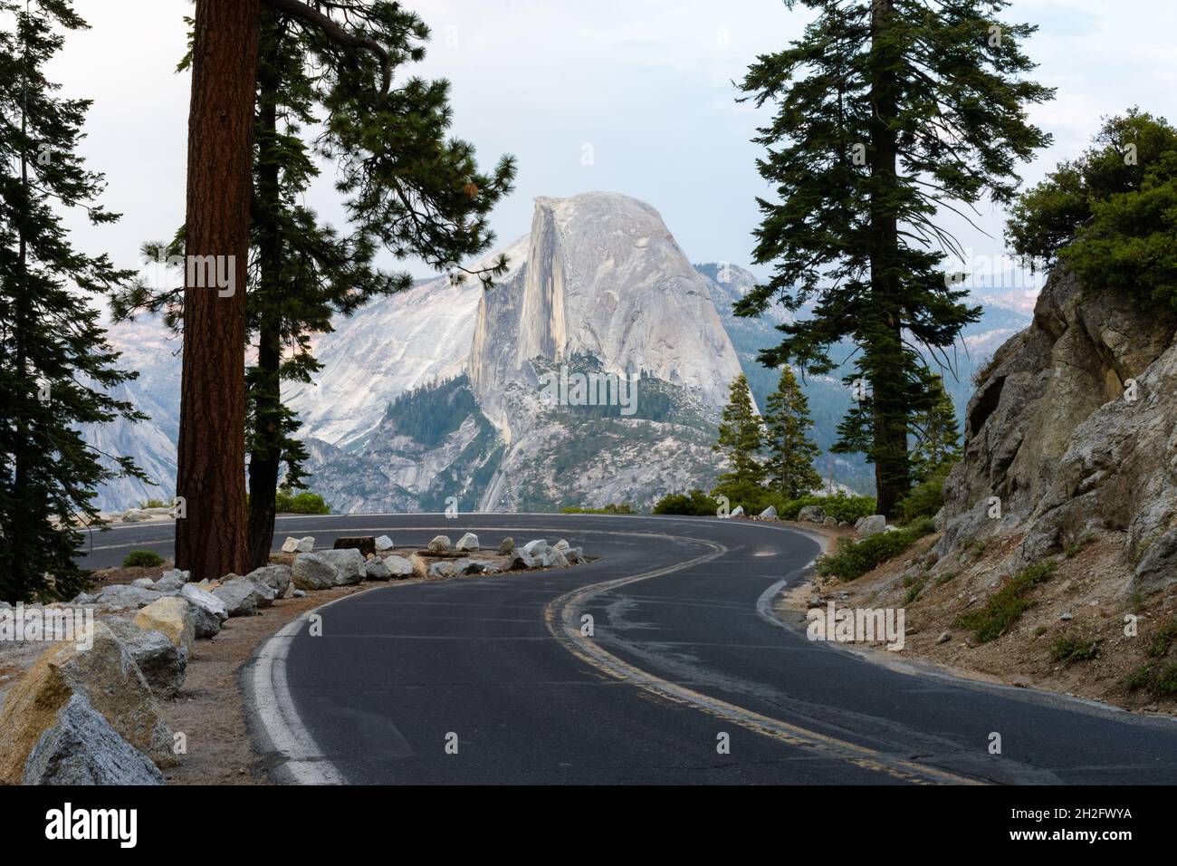 Landscape of the Glacier Point Road surrounded by rocky hills in ...