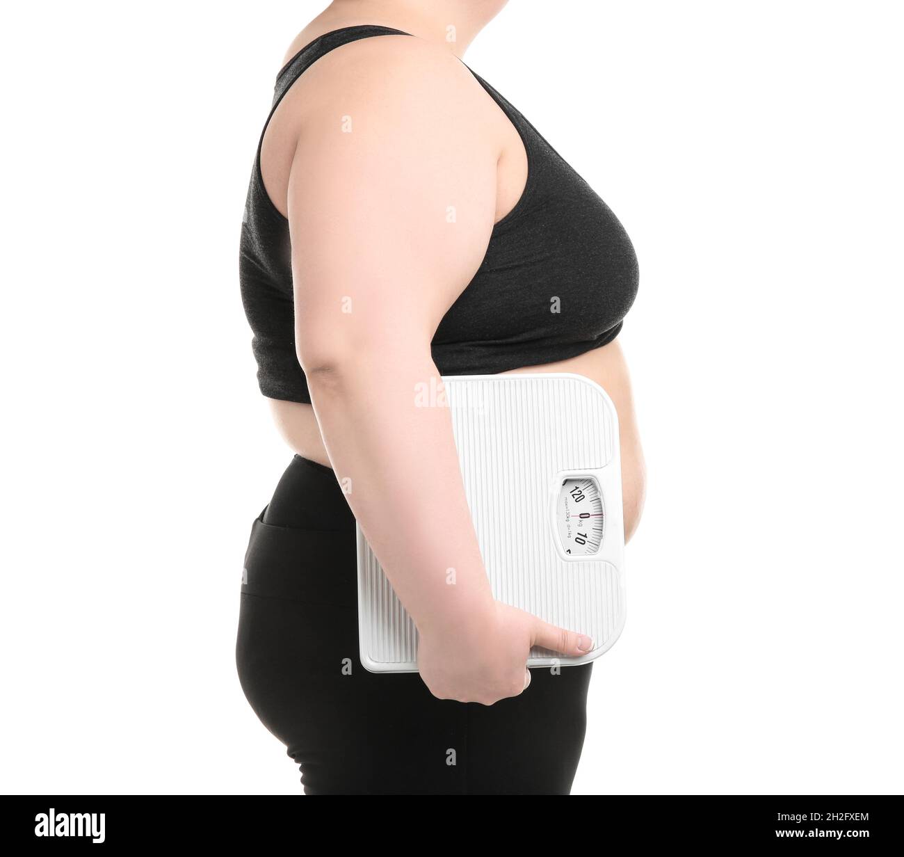Overweight woman with scales on white background Stock Photo - Alamy