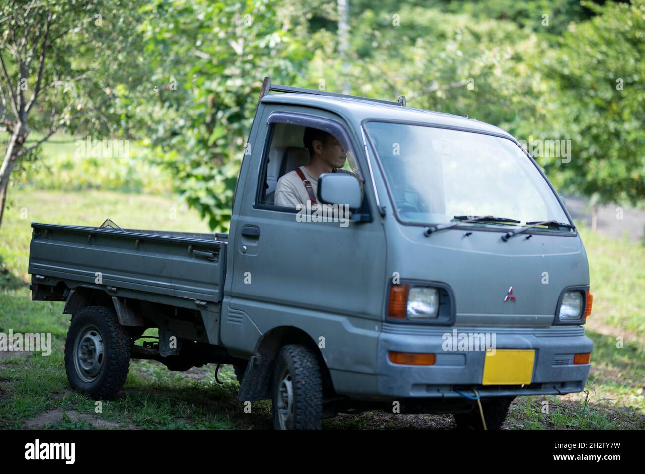 Man Driving Small Truck Stock Photo - Alamy
