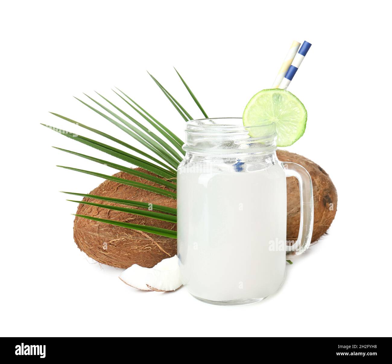 Mason jar with coconut water and nuts on white background Stock Photo ...