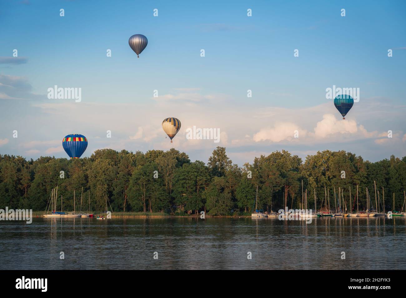 Hot-air Balloons flying over Lake Galve - Trakai, Lithuania Stock Photo ...