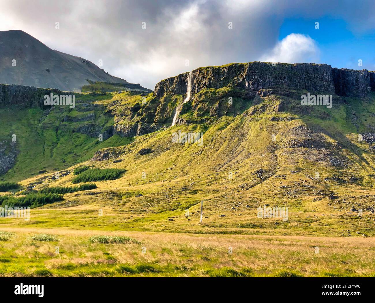 Beautiful highland with green fields and rocks Stock Photo - Alamy