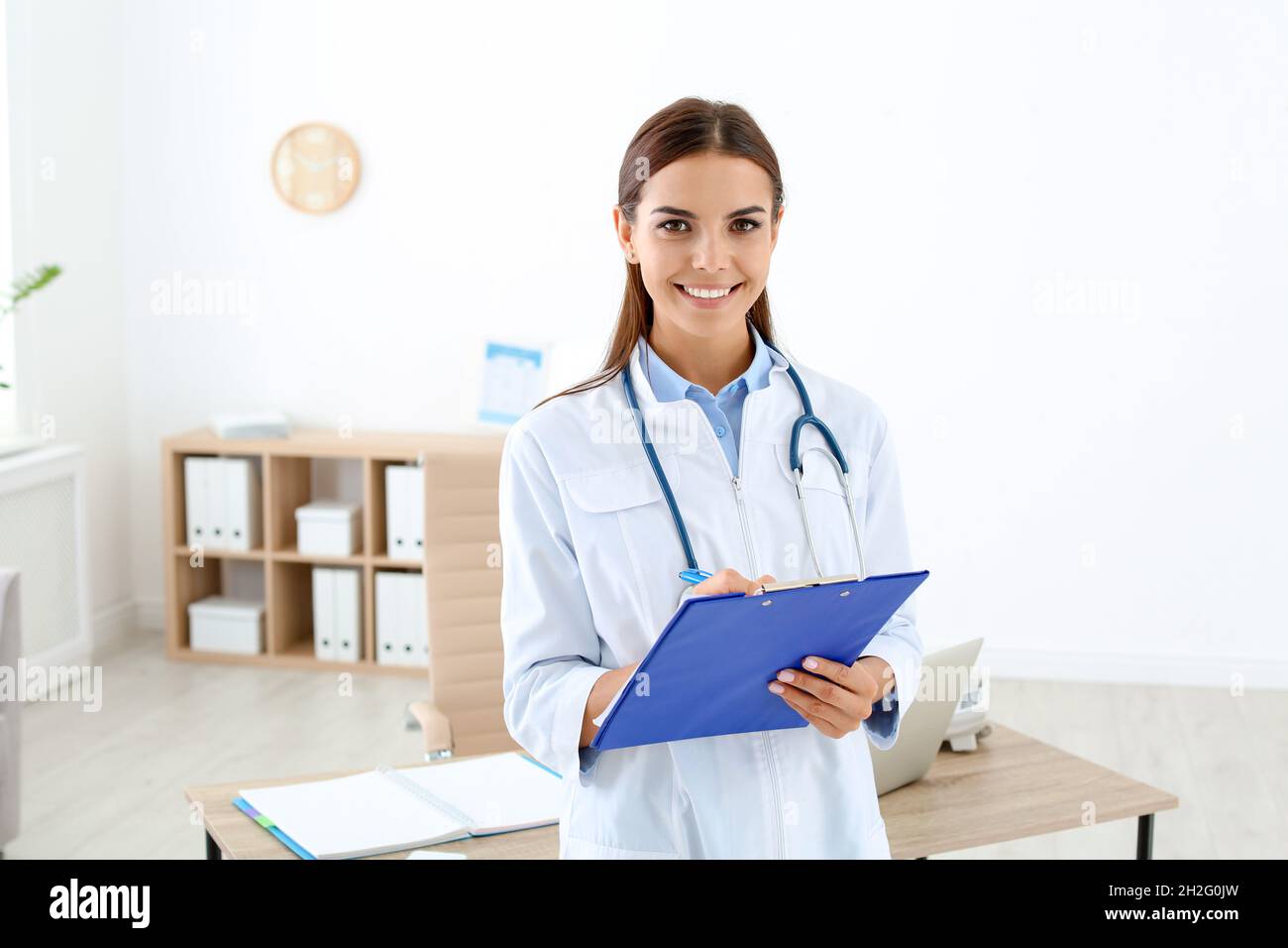 Female medical assistant working in clinic. Health care service Stock ...