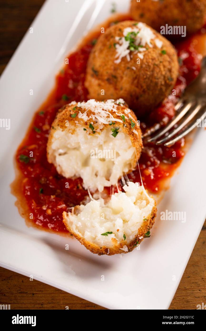Mozzarella arancini, stuffed rice balls, italian appetizer Stock Photo ...