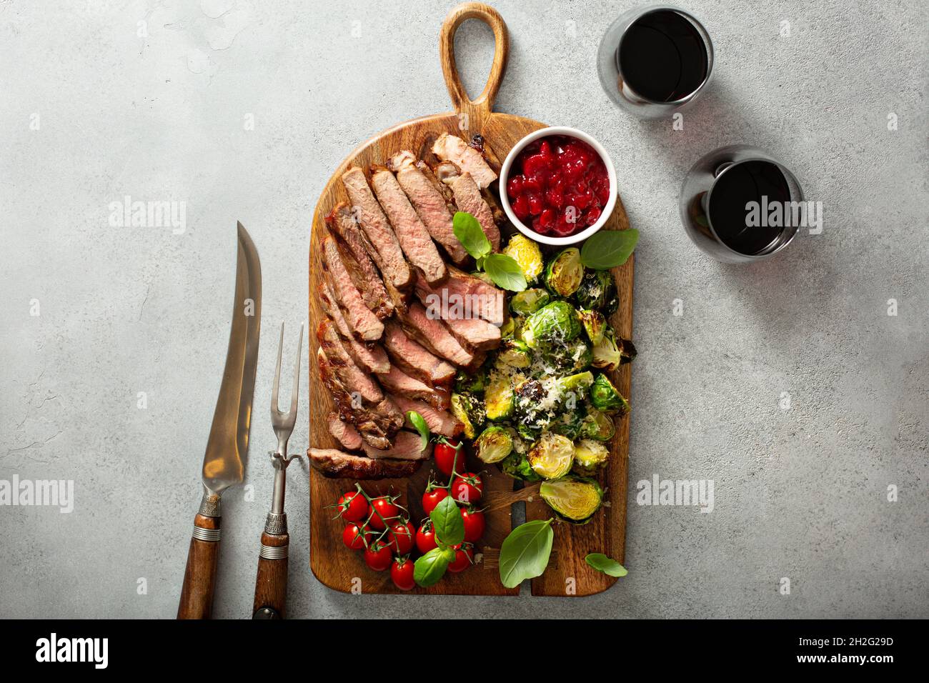 Holiday steak and brussel sprouts for Christmas Stock Photo - Alamy