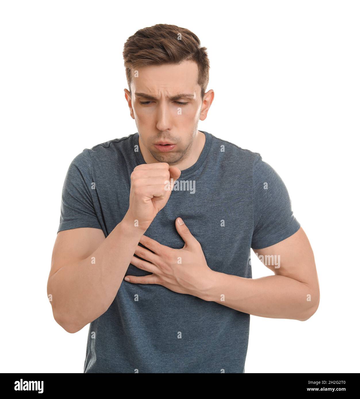 Young man coughing on white background Stock Photo - Alamy